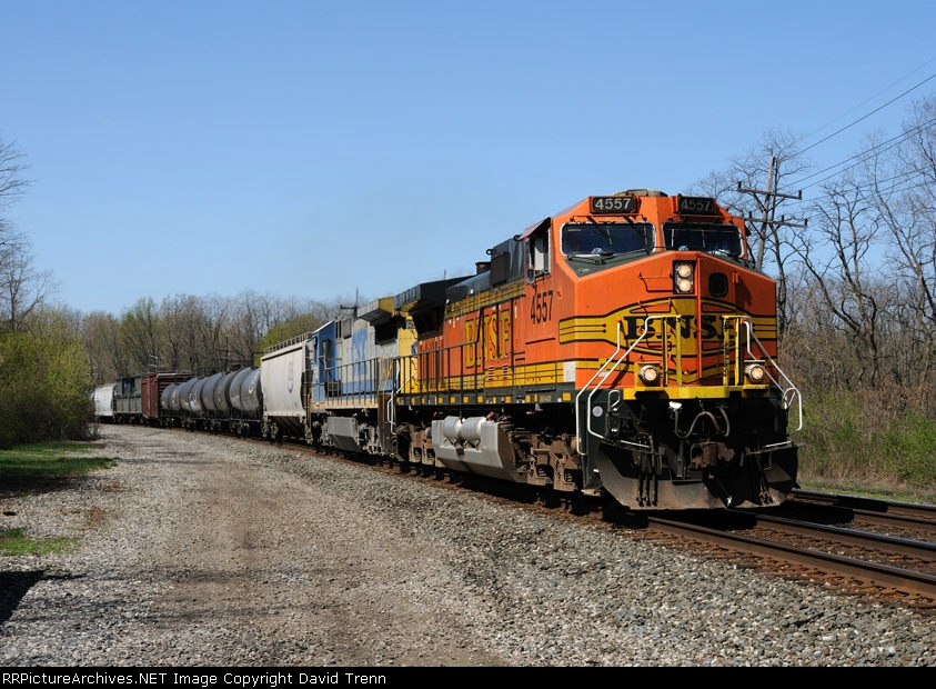 BNSF 4557 leads Eastbound CSX Q380 at MP 152.5 Fobes Rd on track number two.